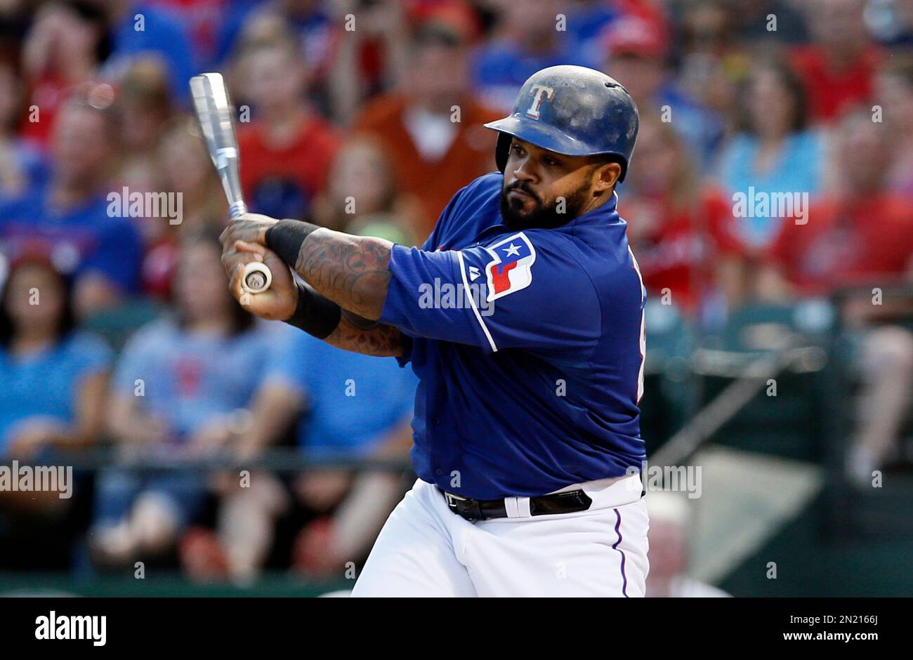 Texas Rangers' Prince Fielder follows through on a swing against the ...
