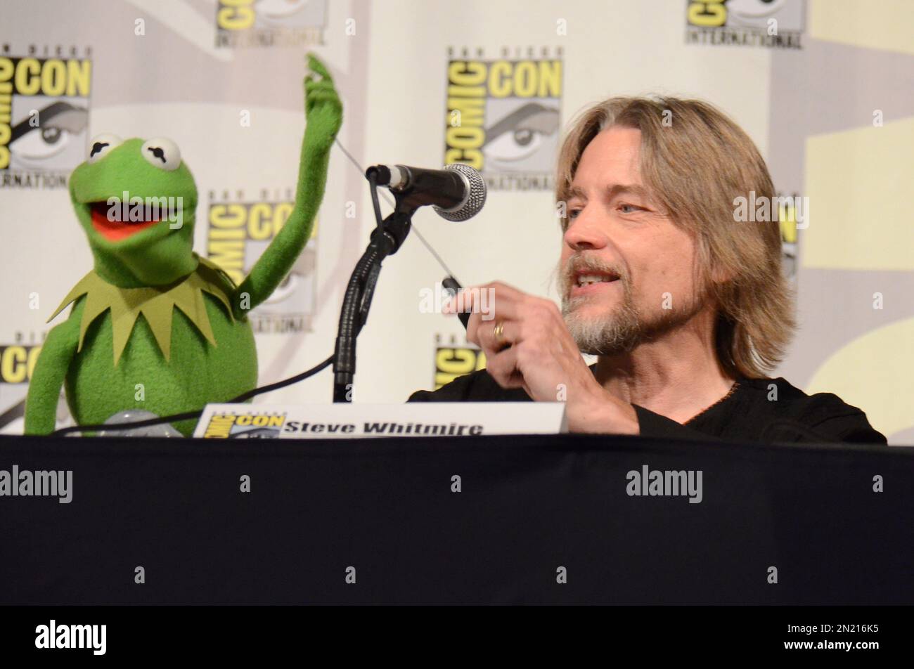 Kermit the Frog, left, and puppeteer Steve Whitmire attend "The Muppets" panel on day 3 of Comic ...