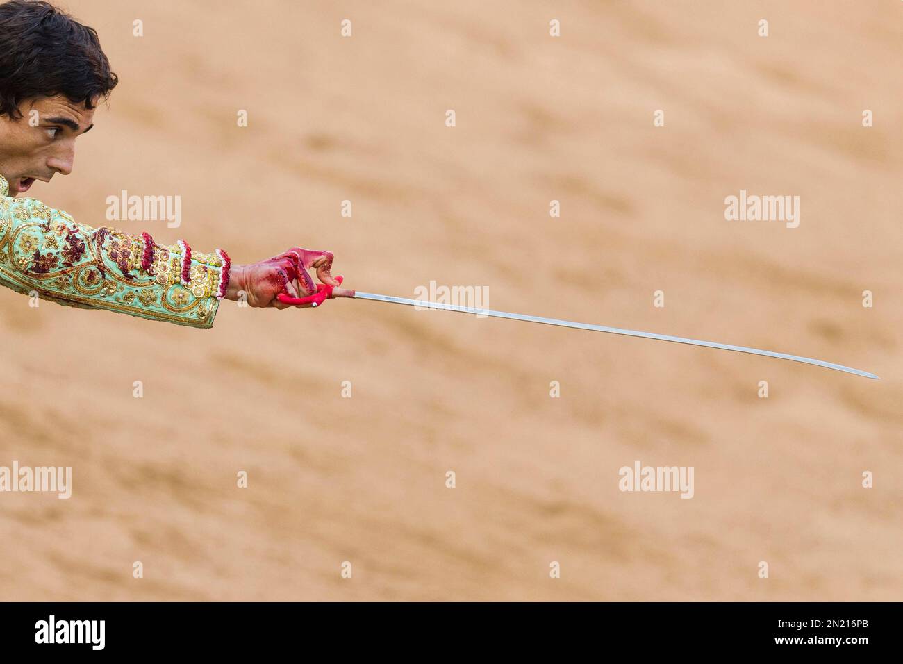 Spanish bullfighter Paco Urena aims his sword before killing a bull ...
