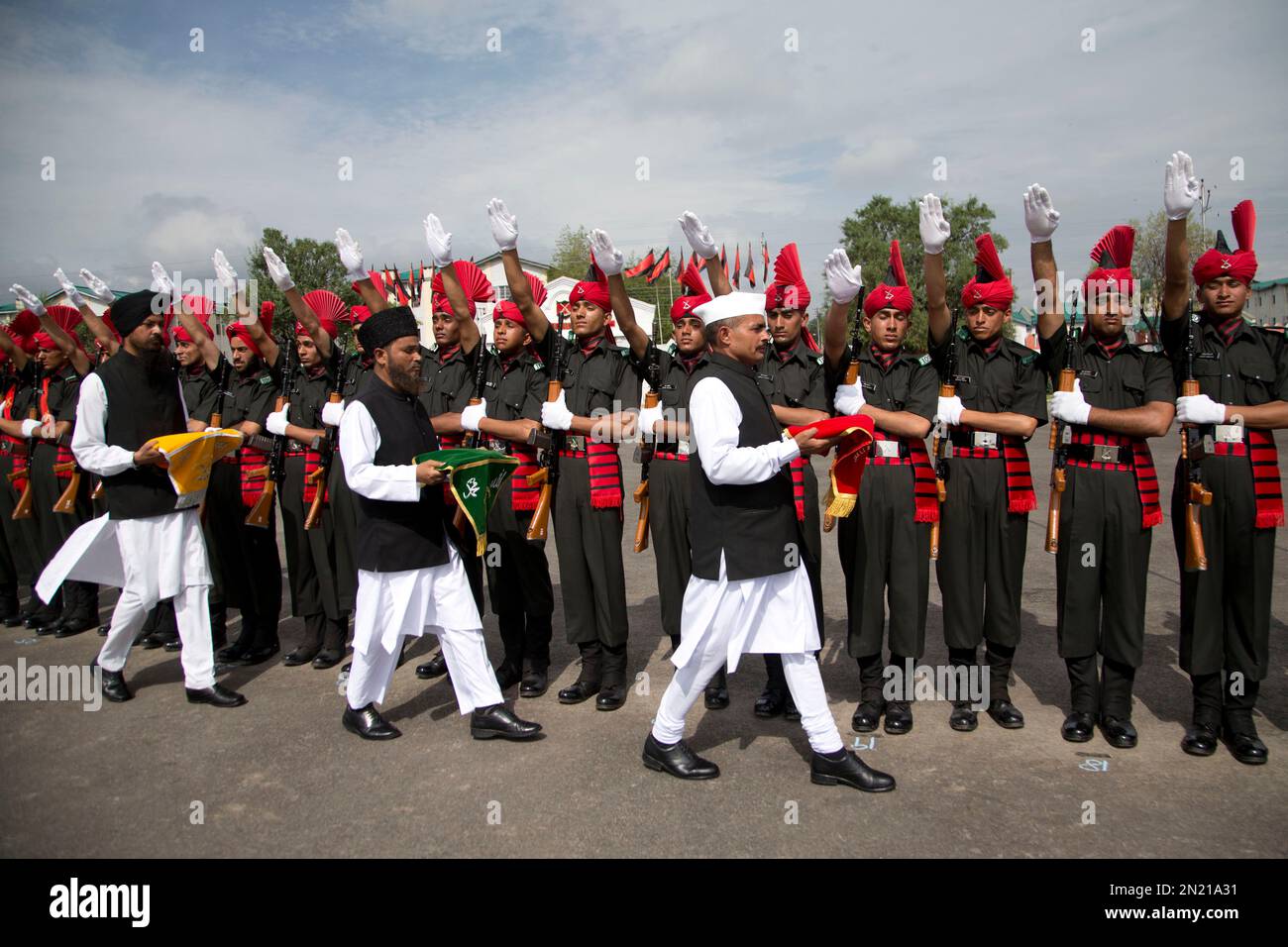 From left, Sikh, Muslim and Hindu priests hold holy books as Indian ...