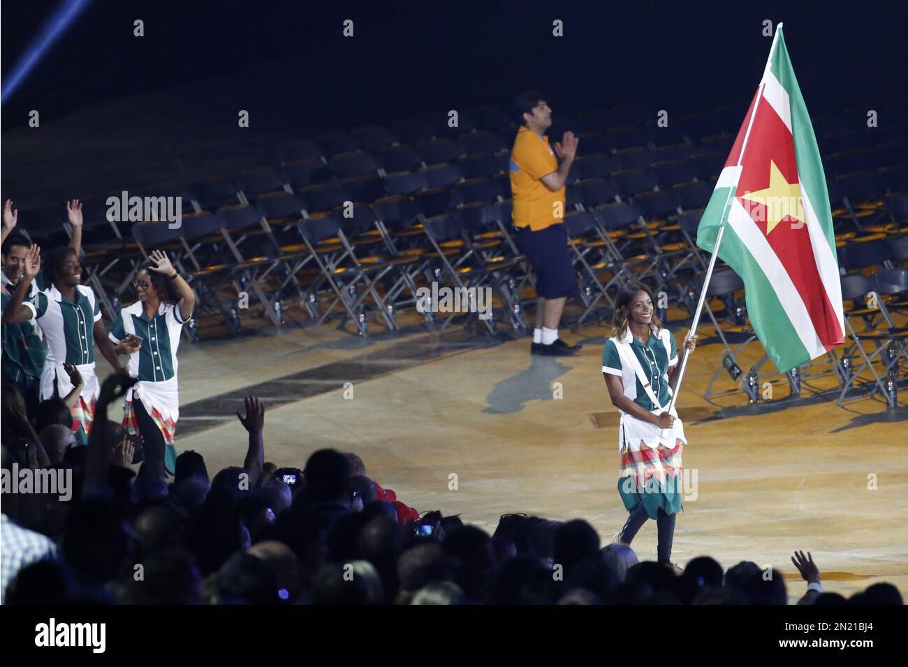 Chinyere Pigot carries the national flag of Suriname during the opening ...