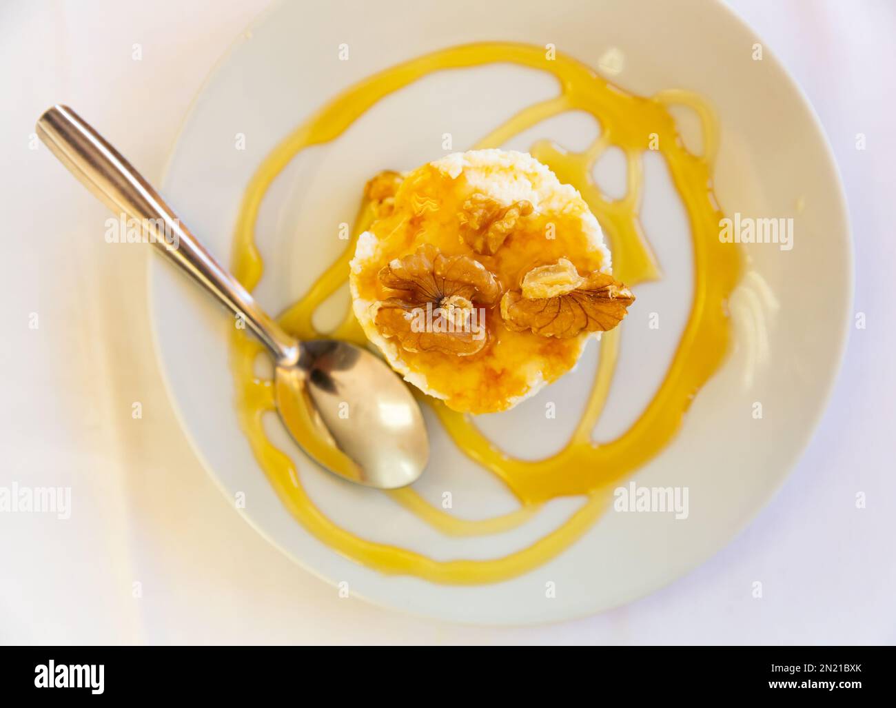 Fresh cottage cheese with honey and walnuts Stock Photo - Alamy