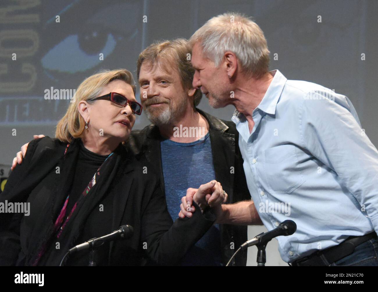 Carrie Fisher, from left, Mark Hamill, and Harrison Ford attend ...