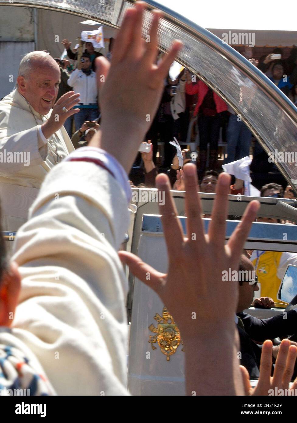 Pope Francis waves from his popemobile as he leaves after addressing ...