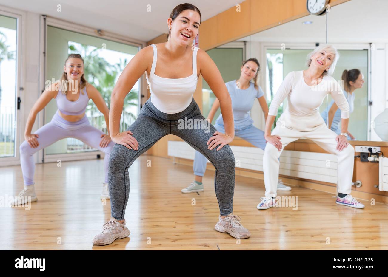 Active young woman practicing aerobic dance in training hall Stock ...