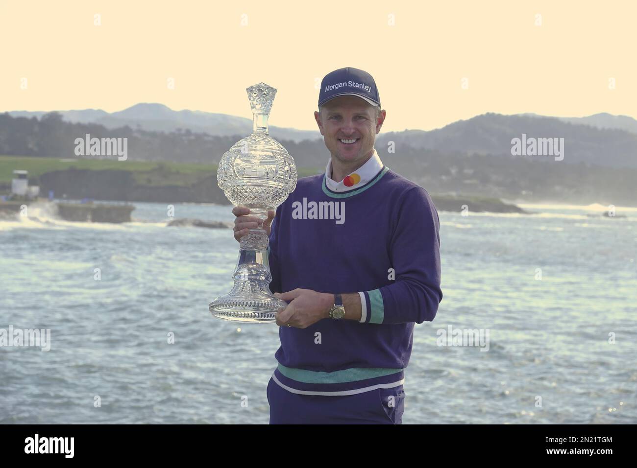 Pebble Beach, CA, USA. 6th Feb, 2023. Justin Rose and trophy pose on the ocean bank alongside ...