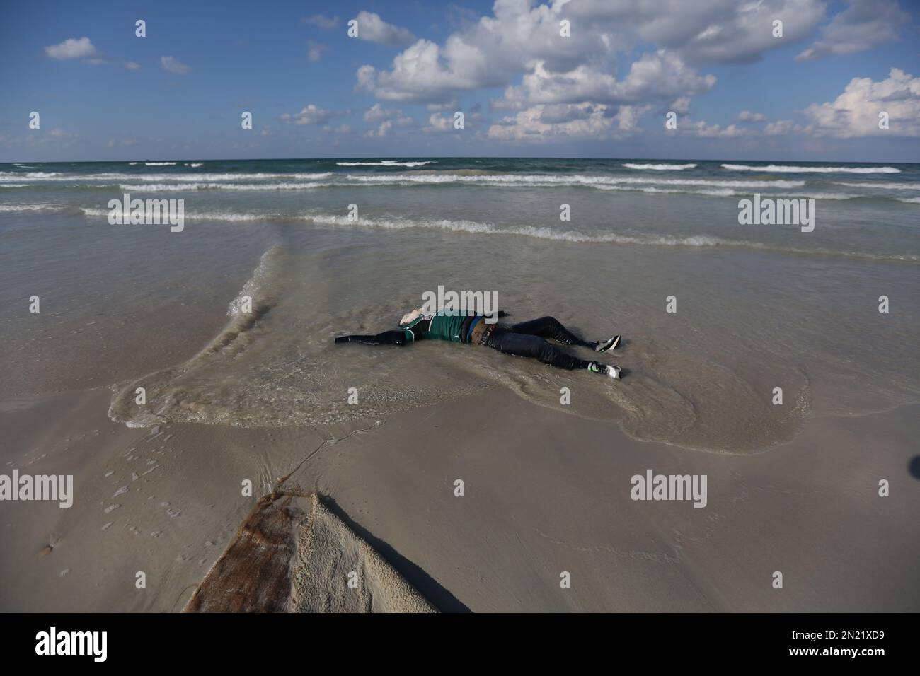 This Oct. 2, 2014 photo, shows the body of a Syrian migrant who washed ...