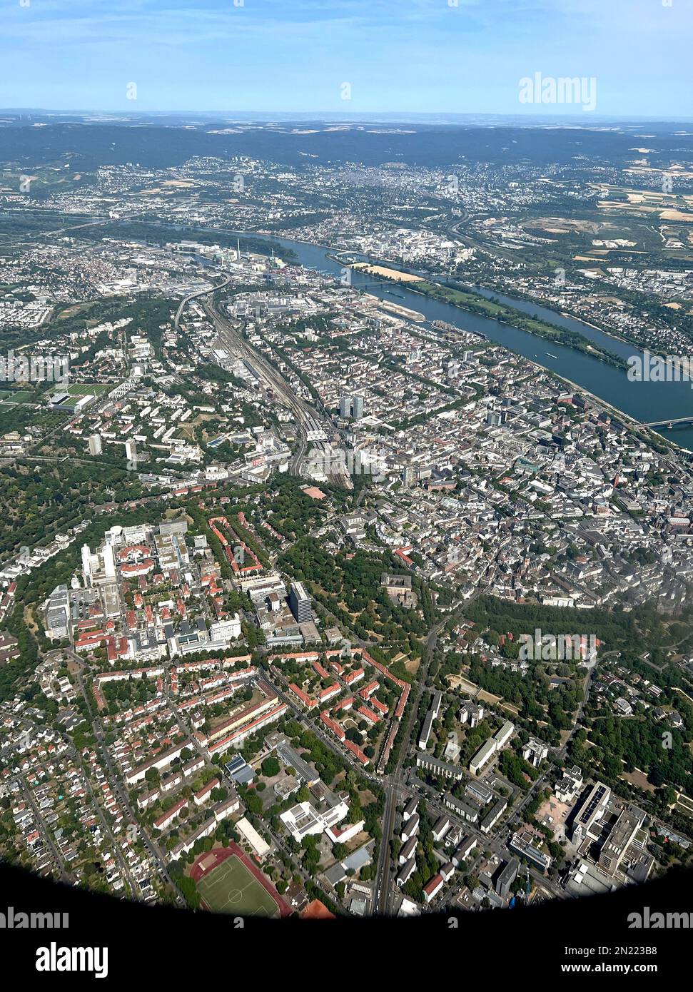 Looking out the window of an airplane that is flying over Mainz ...