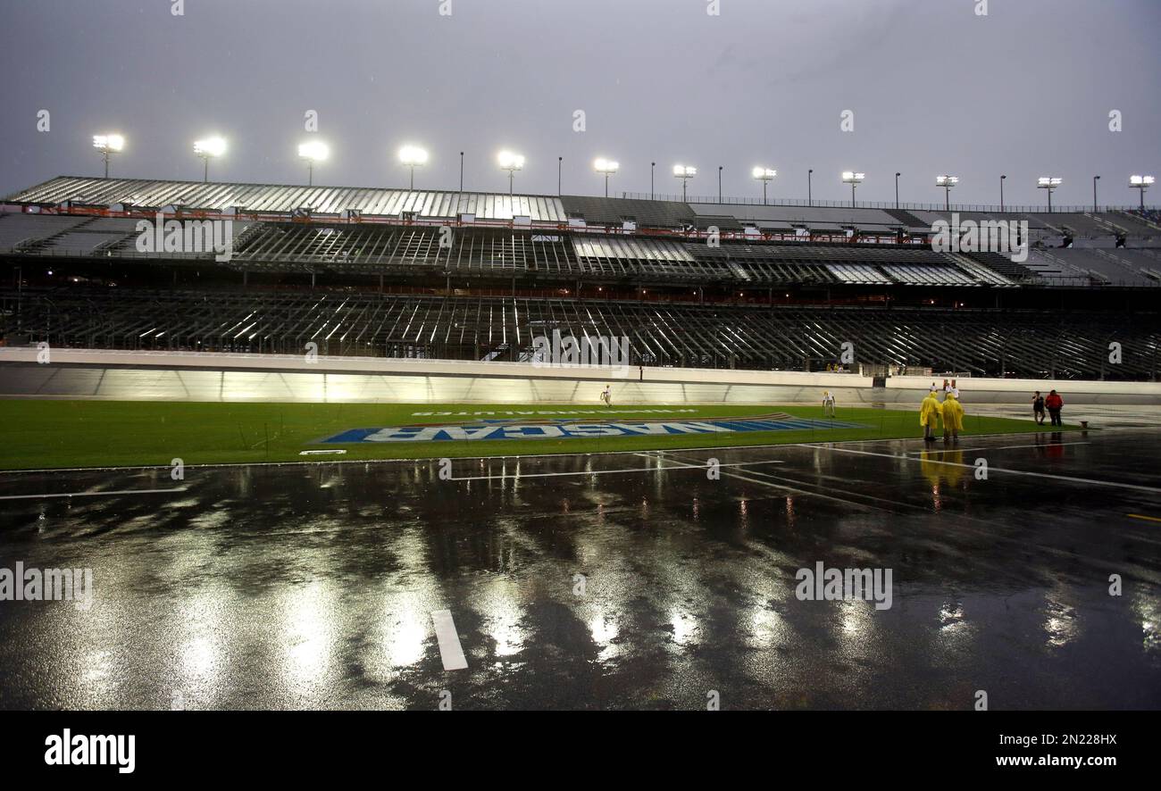 Empty grandstands under construction are seen during a rain delay ...