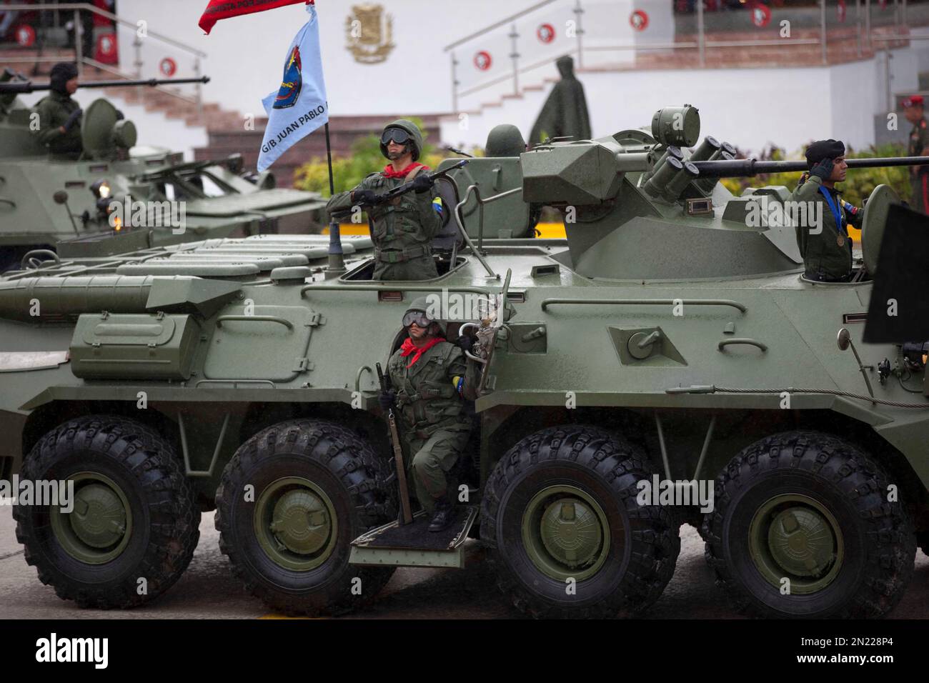 Soldiers ride aboard armored military vehicles during a parade marking ...