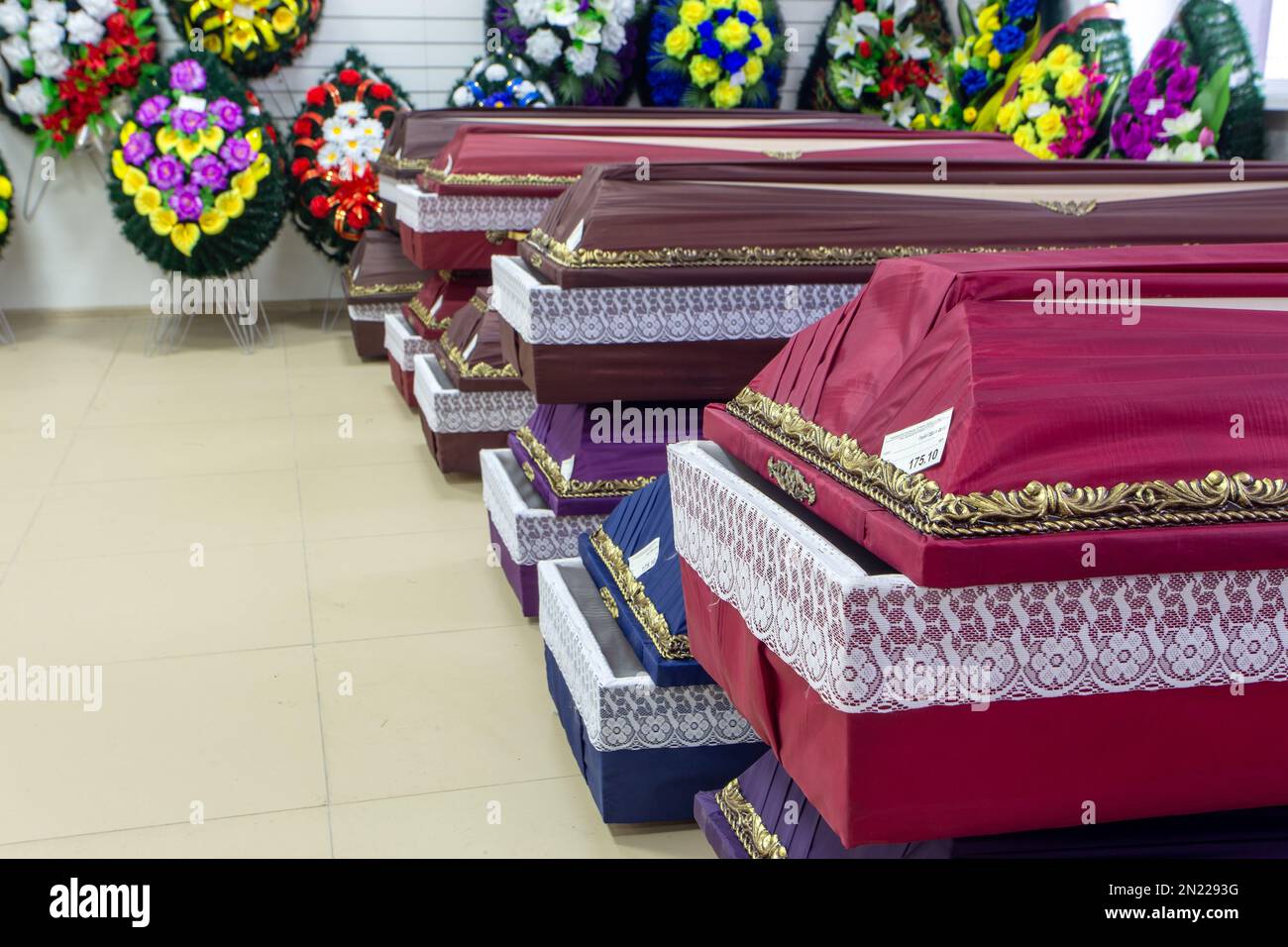 Interior of room with funeral accessories. Shop selling coffins ...