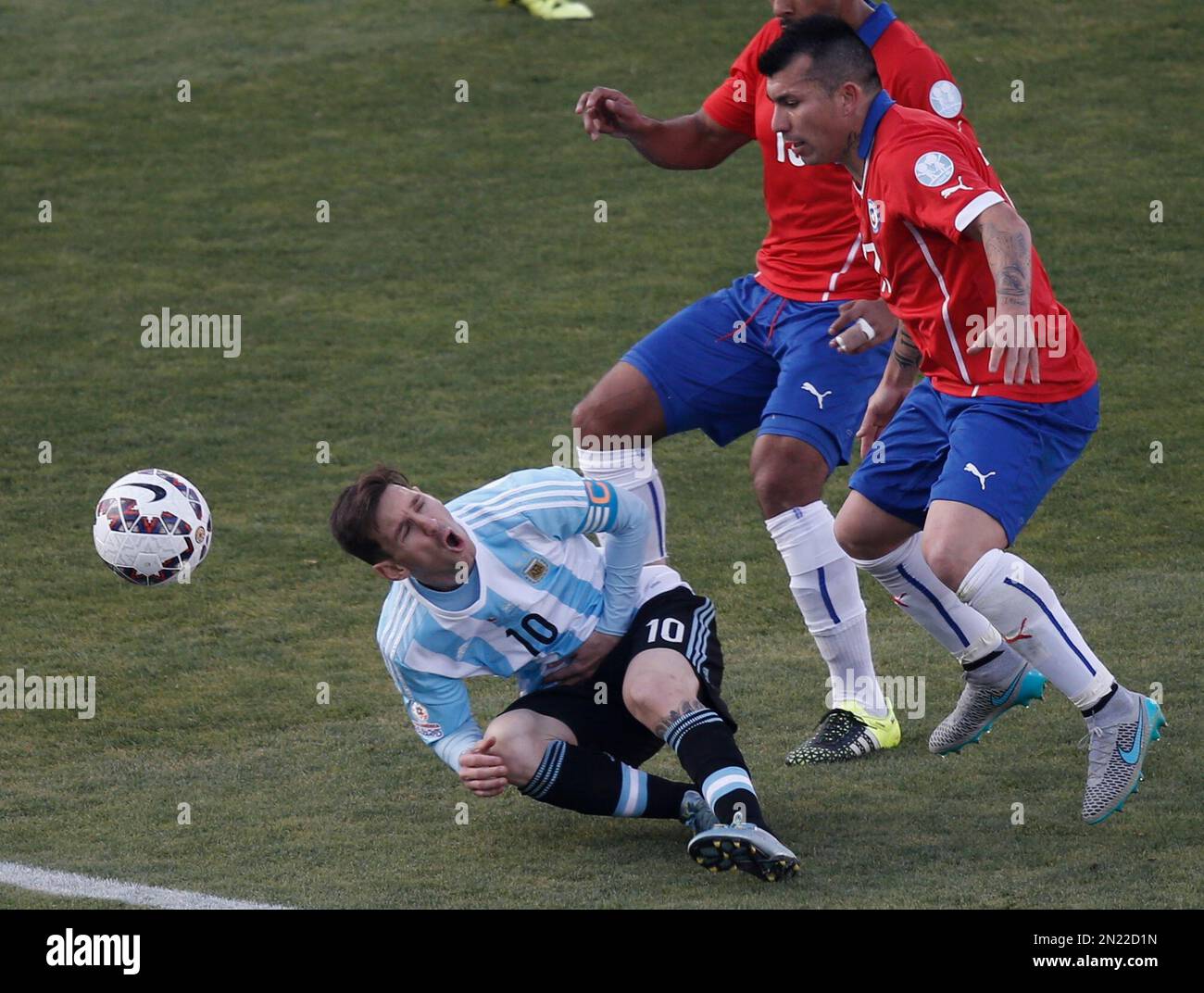 Argentina's Lionel Messi, ground, reacts after being fouled by Chile's ...