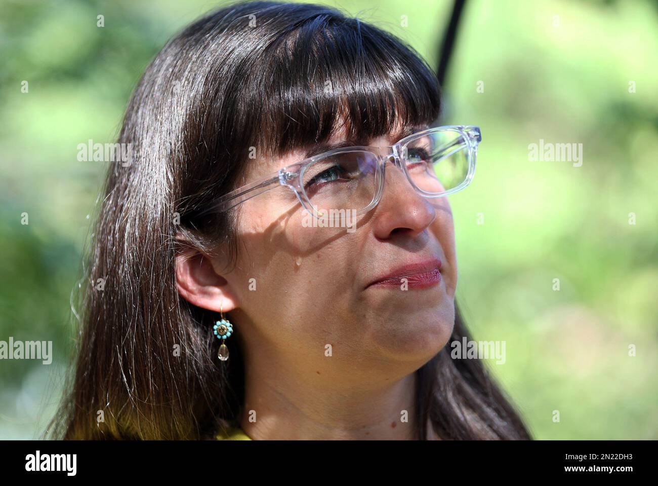 FILE - In this June 22, 2014, file photo, a tear rolls down the face of ...