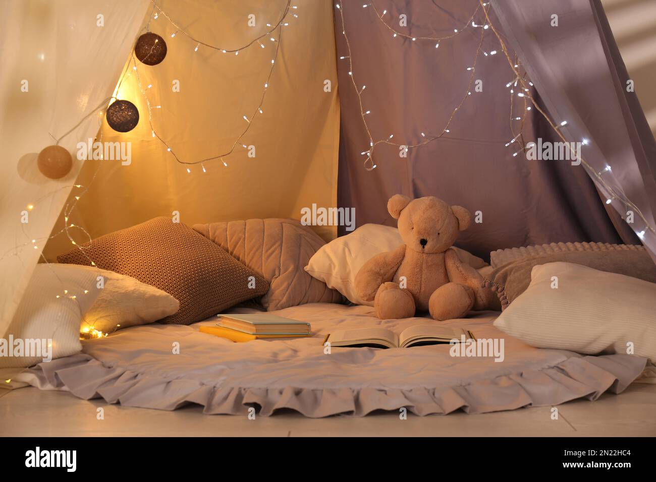 Play tent with books, pillows and Teddy bear. Modern children's room ...