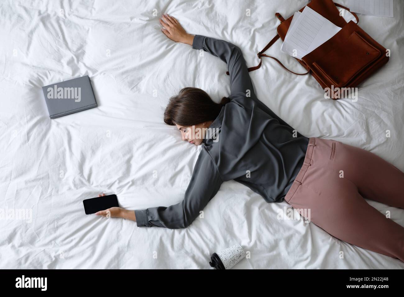 Fully dressed woman lying on bed hi-res stock photography and images ...