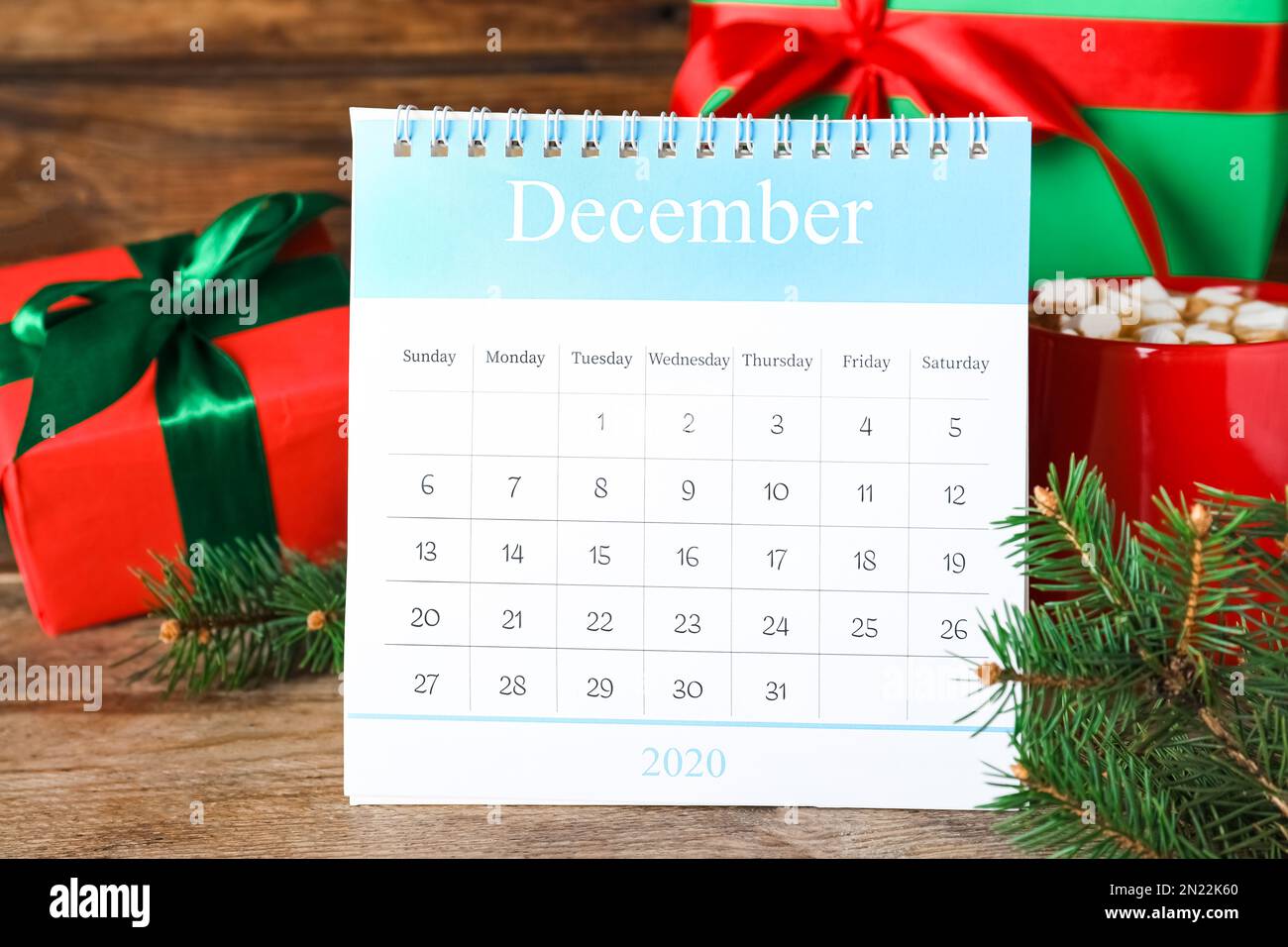 Flip calendar and Christmas decor on wooden table. Holiday countdown ...
