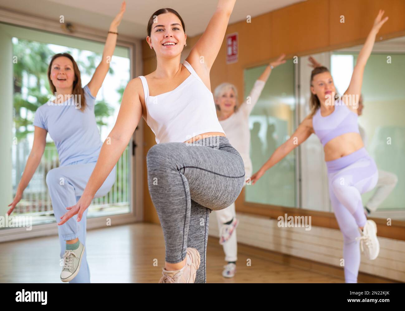 Emotional sportive female dancers of different ages in sportswear ...