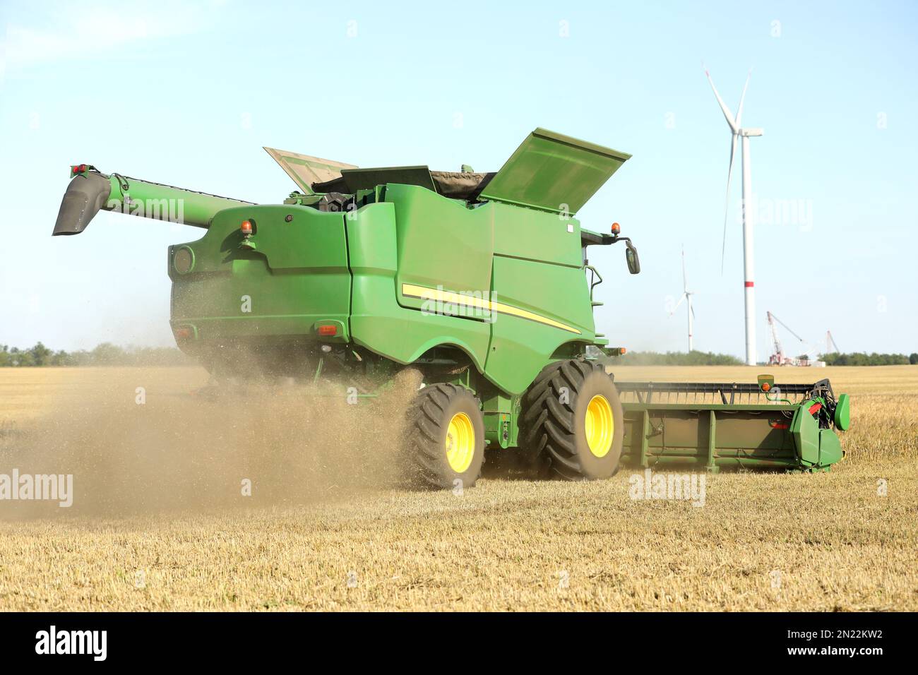 Modern combine harvester working in agricultural field Stock Photo - Alamy