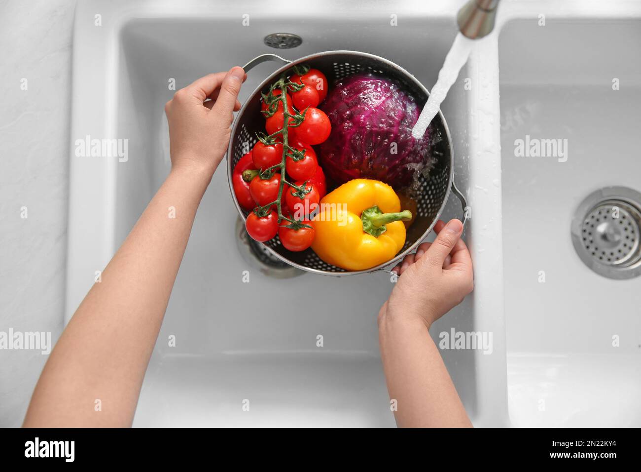 Woman washing different vegetables hi-res stock photography and images ...
