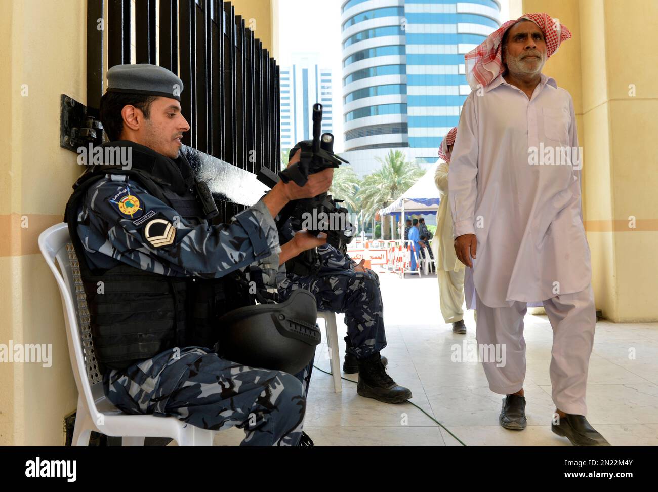 Kuwaiti police are on hand as worshippers arrive for joint Sunni-Shiite ...
