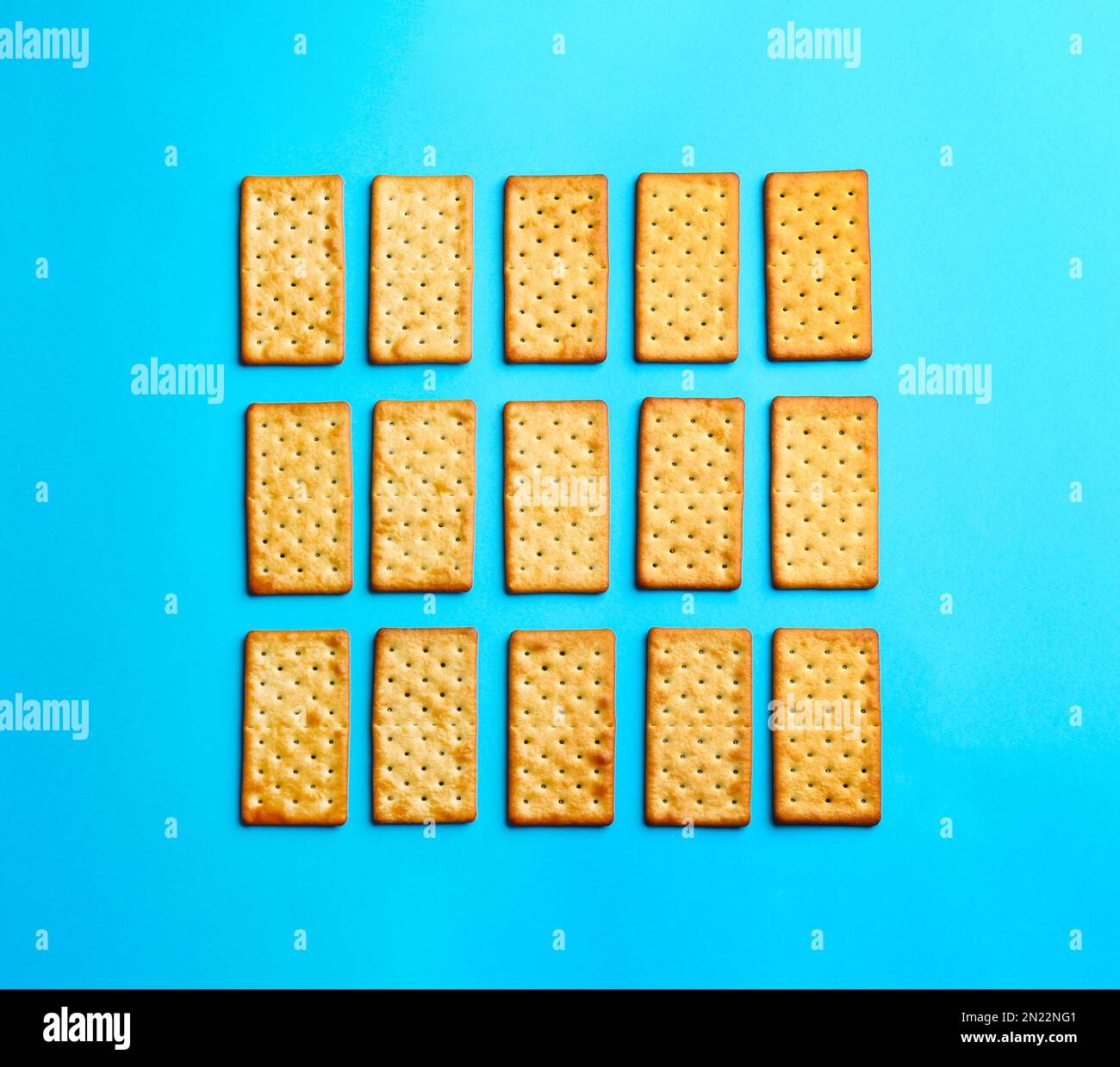Delicious crackers on light blue background, flat lay Stock Photo - Alamy