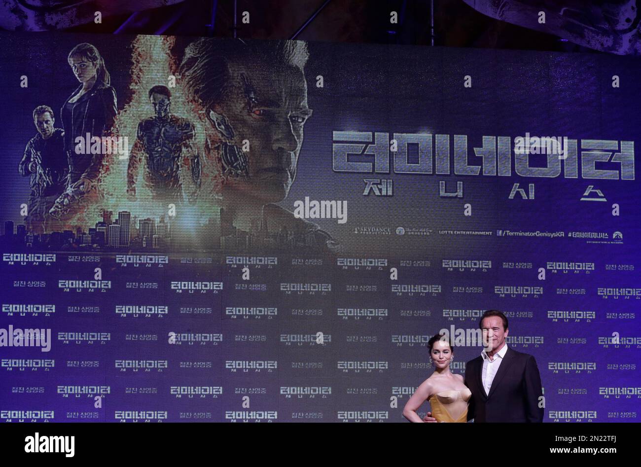 Actress Emilia Clarke and actor Arnold Schwarzenegger pose during the ...