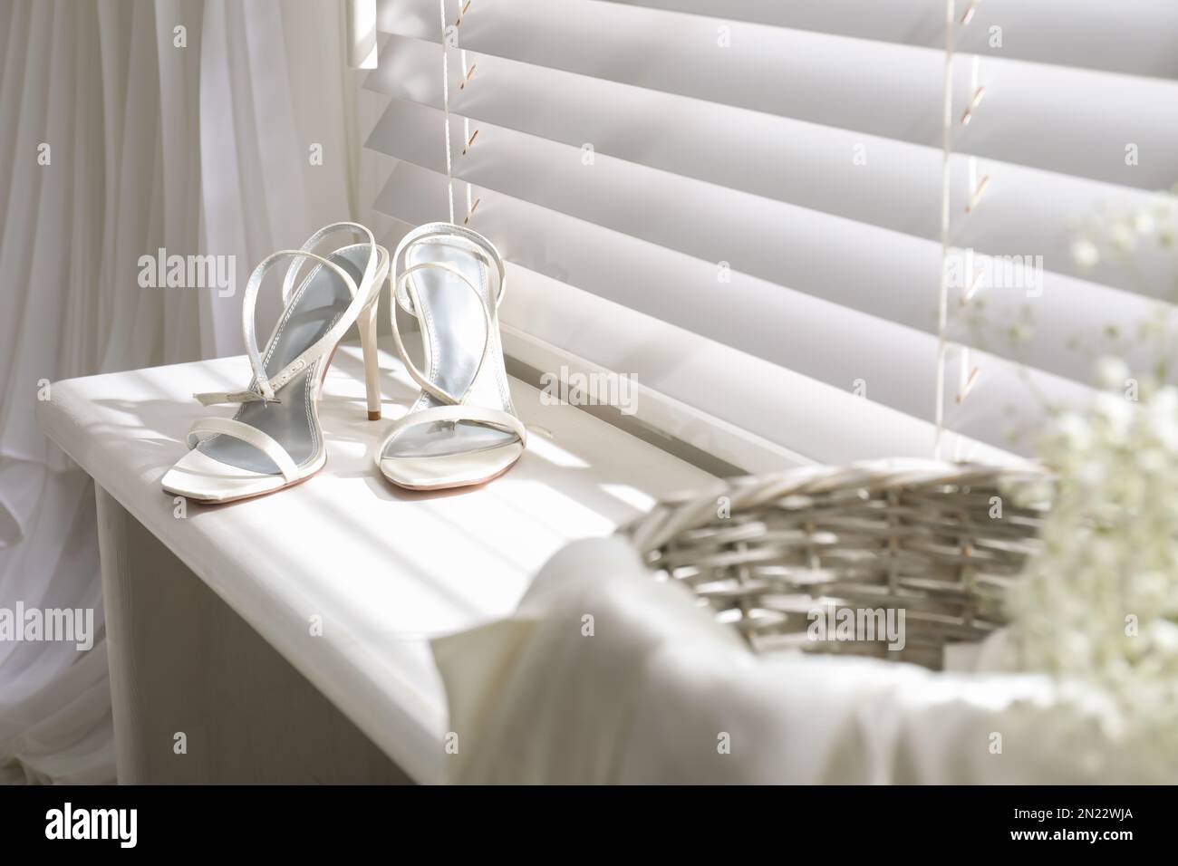 Beautiful wedding shoes on window sill indoors Stock Photo - Alamy