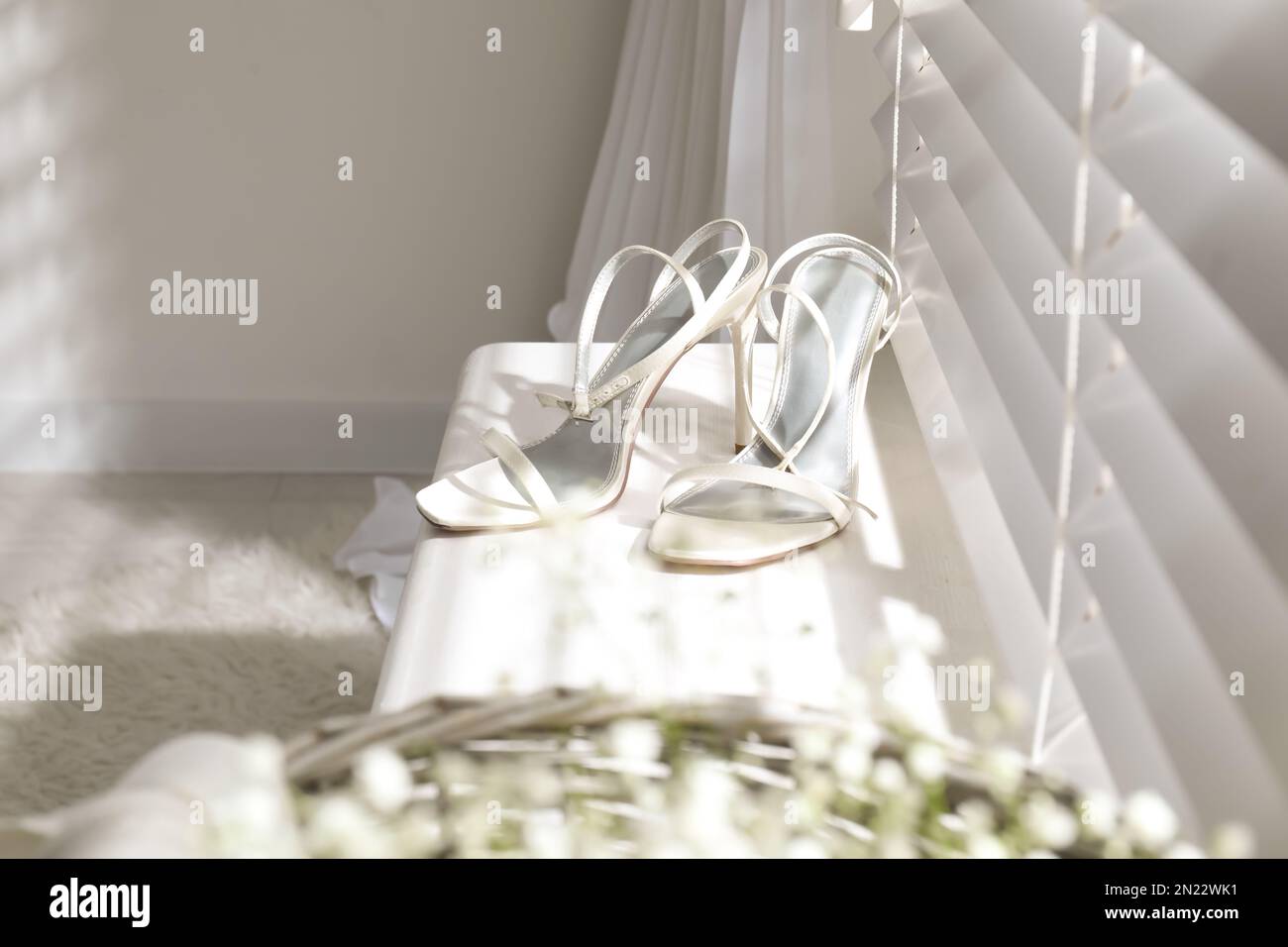 Beautiful wedding shoes on window sill indoors Stock Photo - Alamy