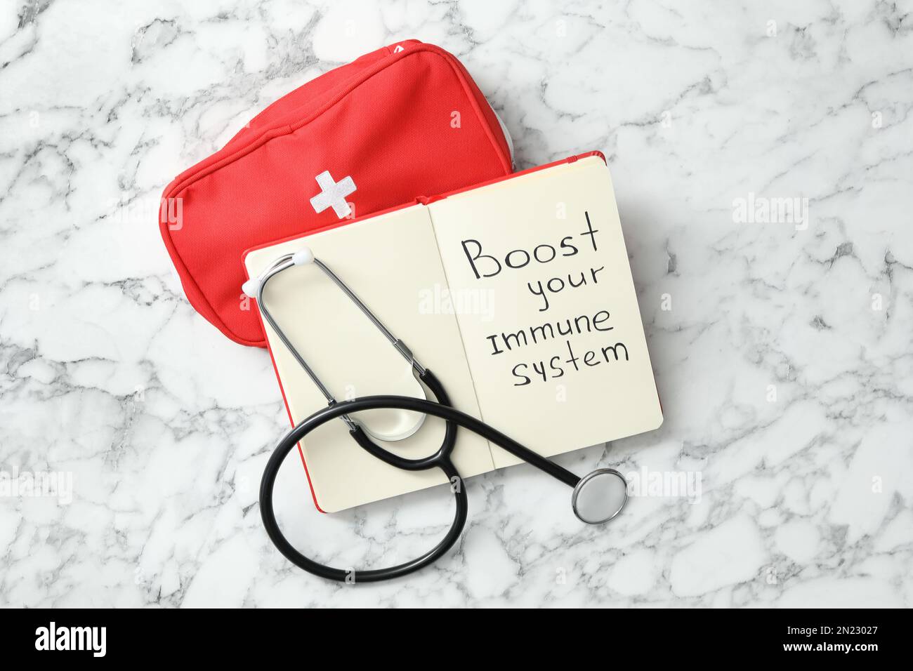 Notebook with words Boost Your Immune System, stethoscope and first aid ...