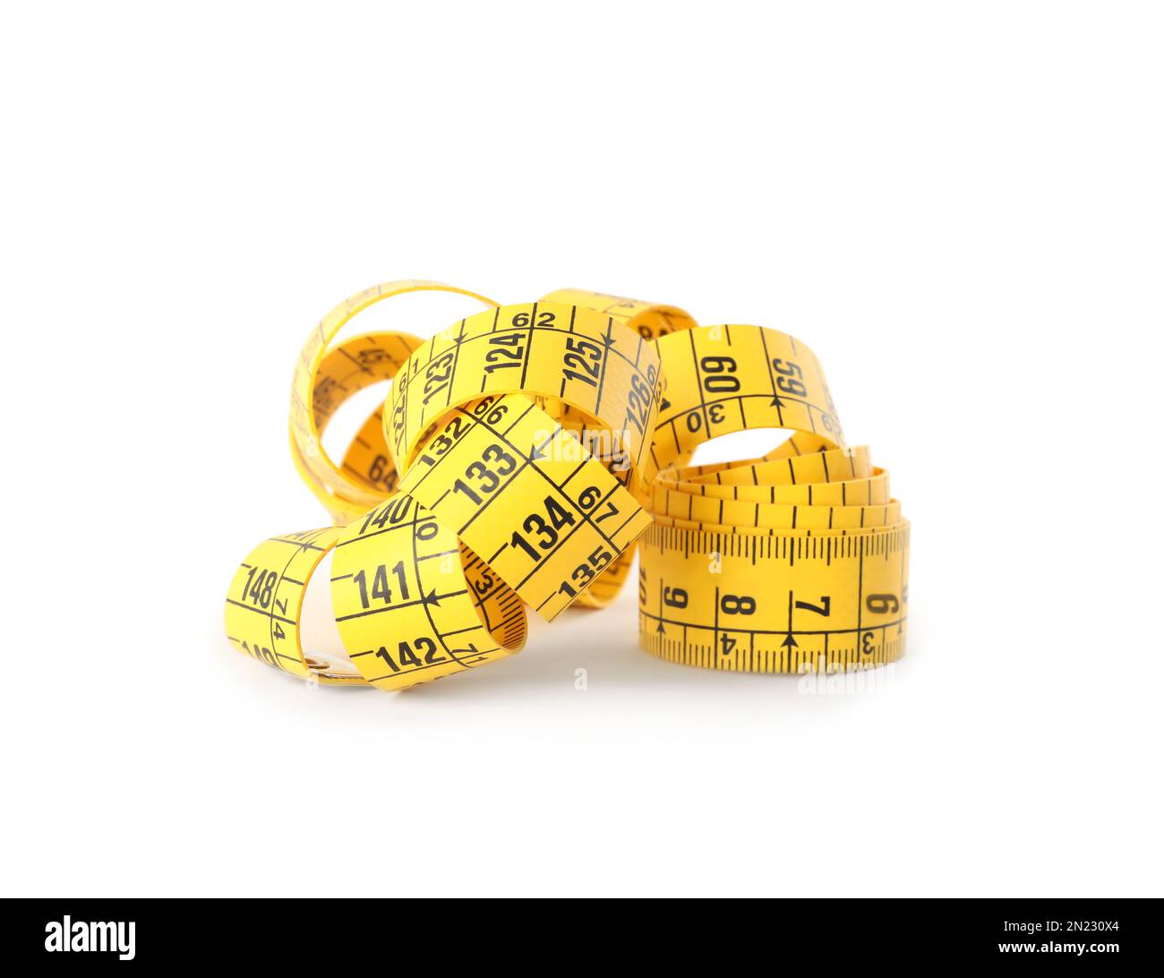 New yellow measuring tape isolated on white Stock Photo - Alamy