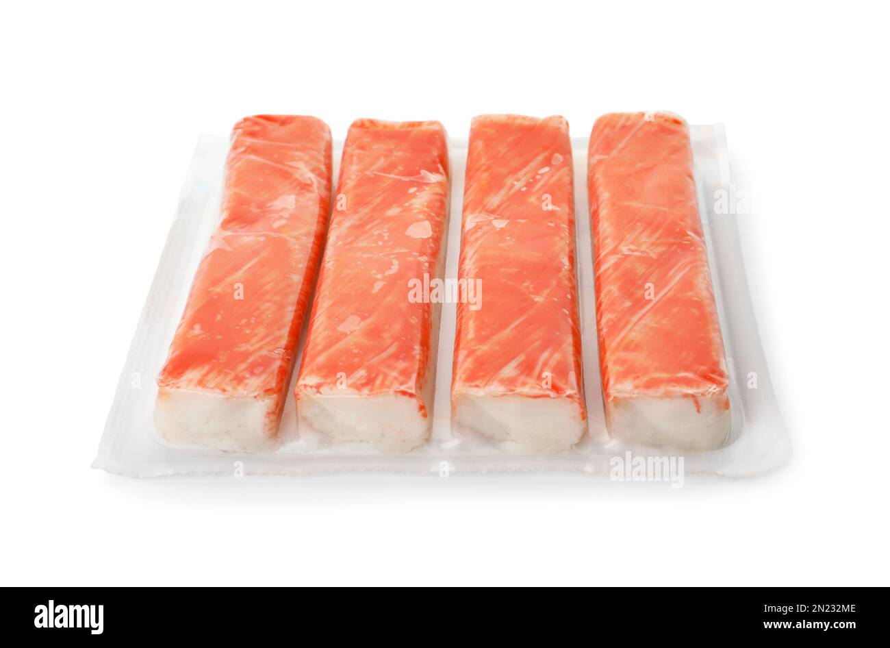 Delicious crab sticks in plastic packaging isolated on white Stock ...