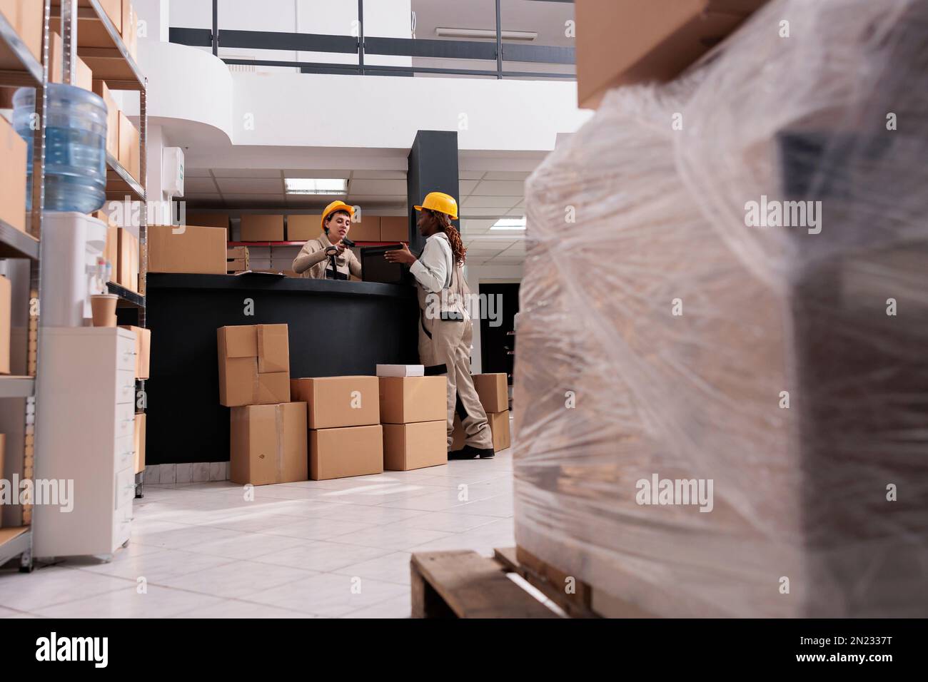 Retail storehouse operative managing product receiving and scanning ...