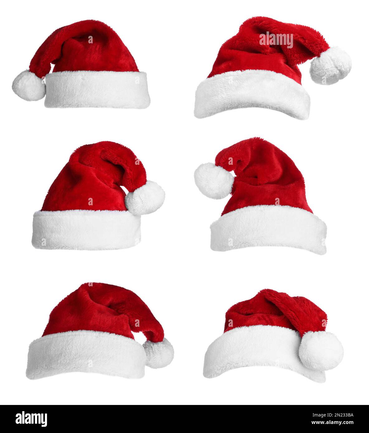 Set of red Santa hats on white background Stock Photo - Alamy
