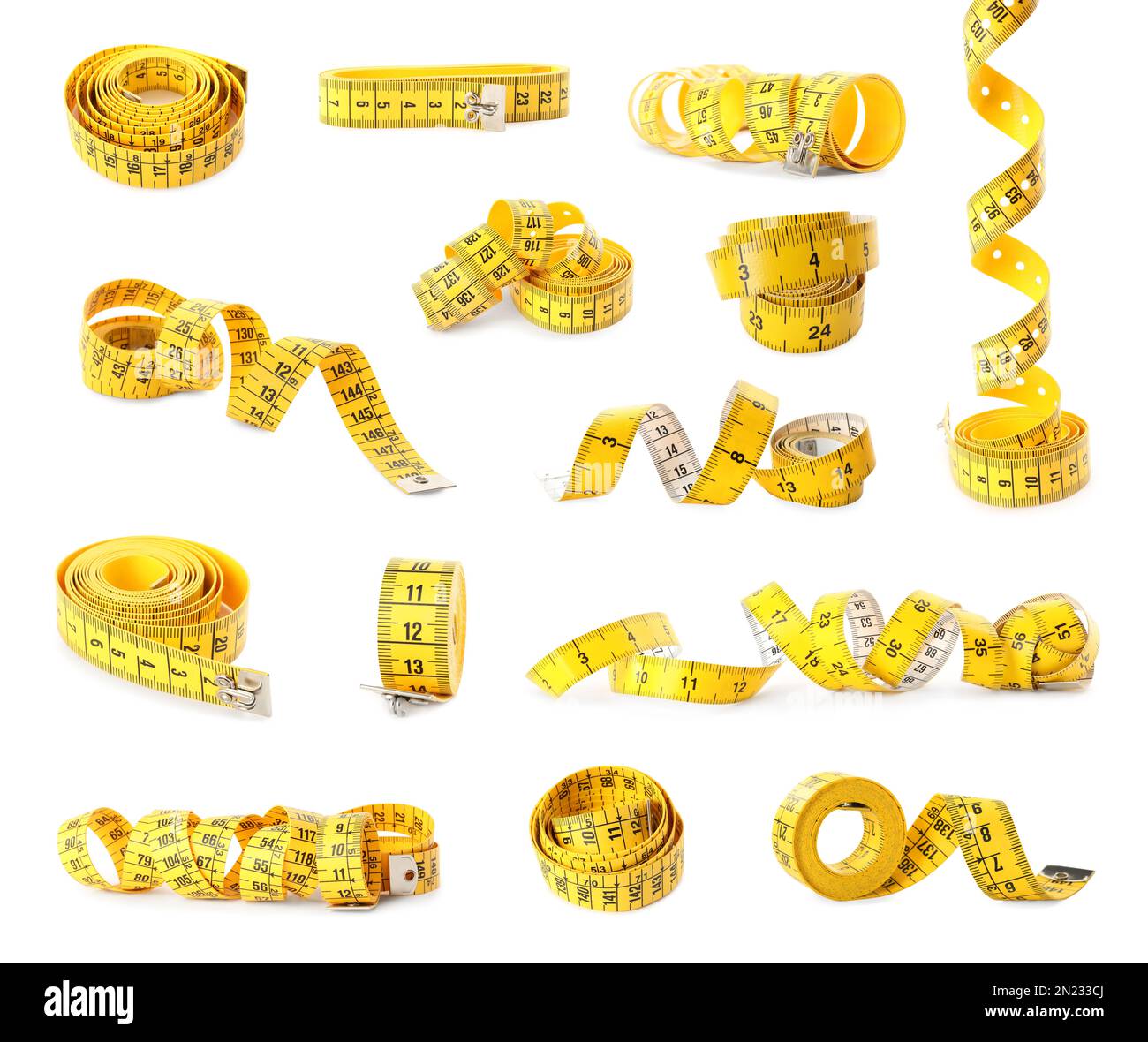 Set of yellow measuring tapes on white background Stock Photo - Alamy