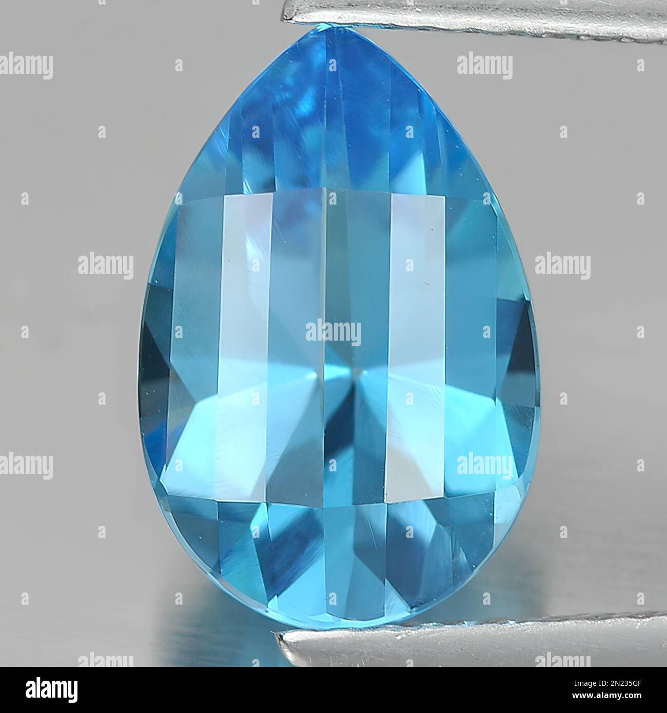 Natural gem blue topaz on white background Stock Photo - Alamy