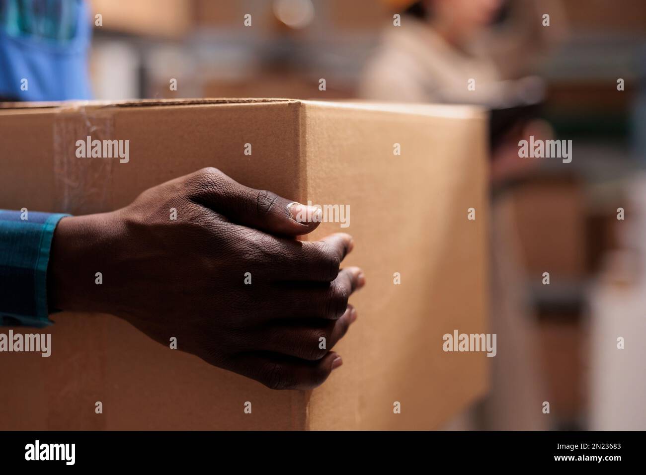 Shipping service warehouse african american man worker holding received ...