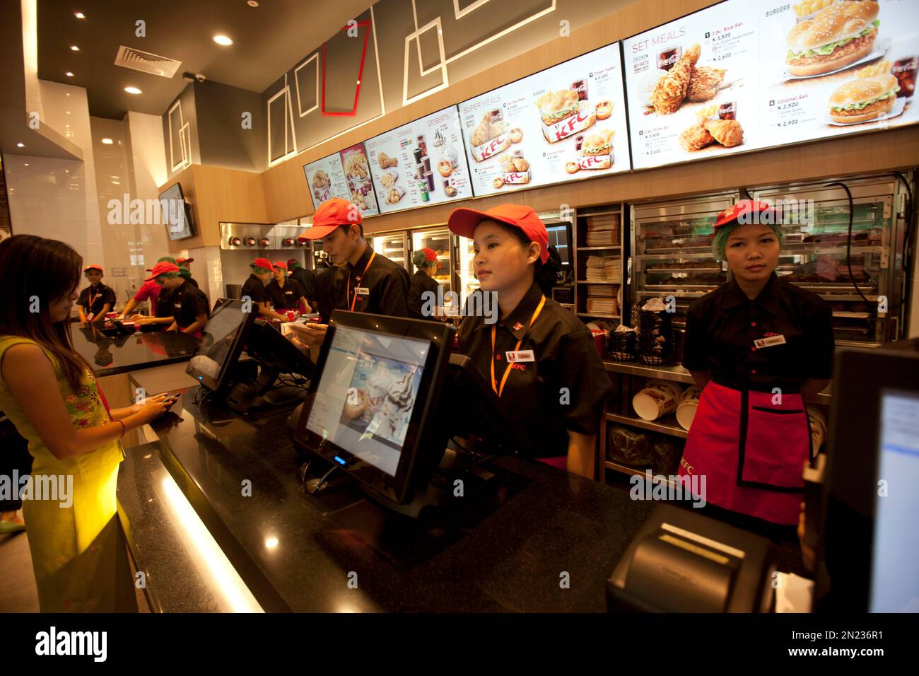 Staffs of KFC restaurant wait to serve for customers during its opening ...