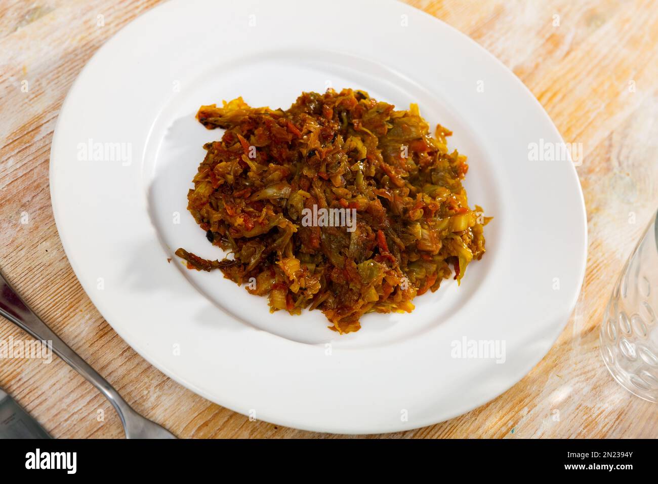 Tasty braised white cabbage with carrot and onion Stock Photo - Alamy