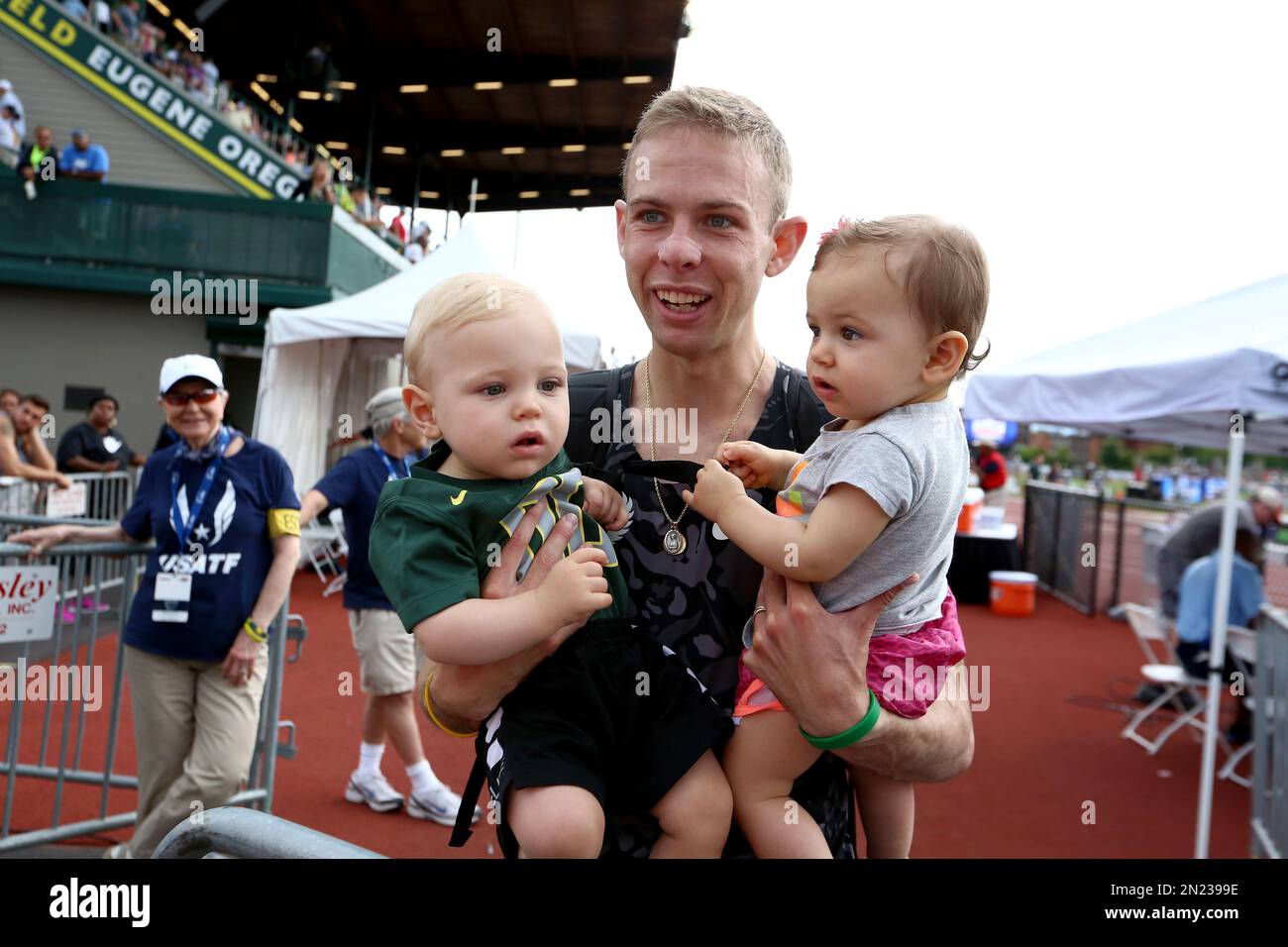 Galen Rupp is shown holding his children, Grayson, left, and Emmie ...