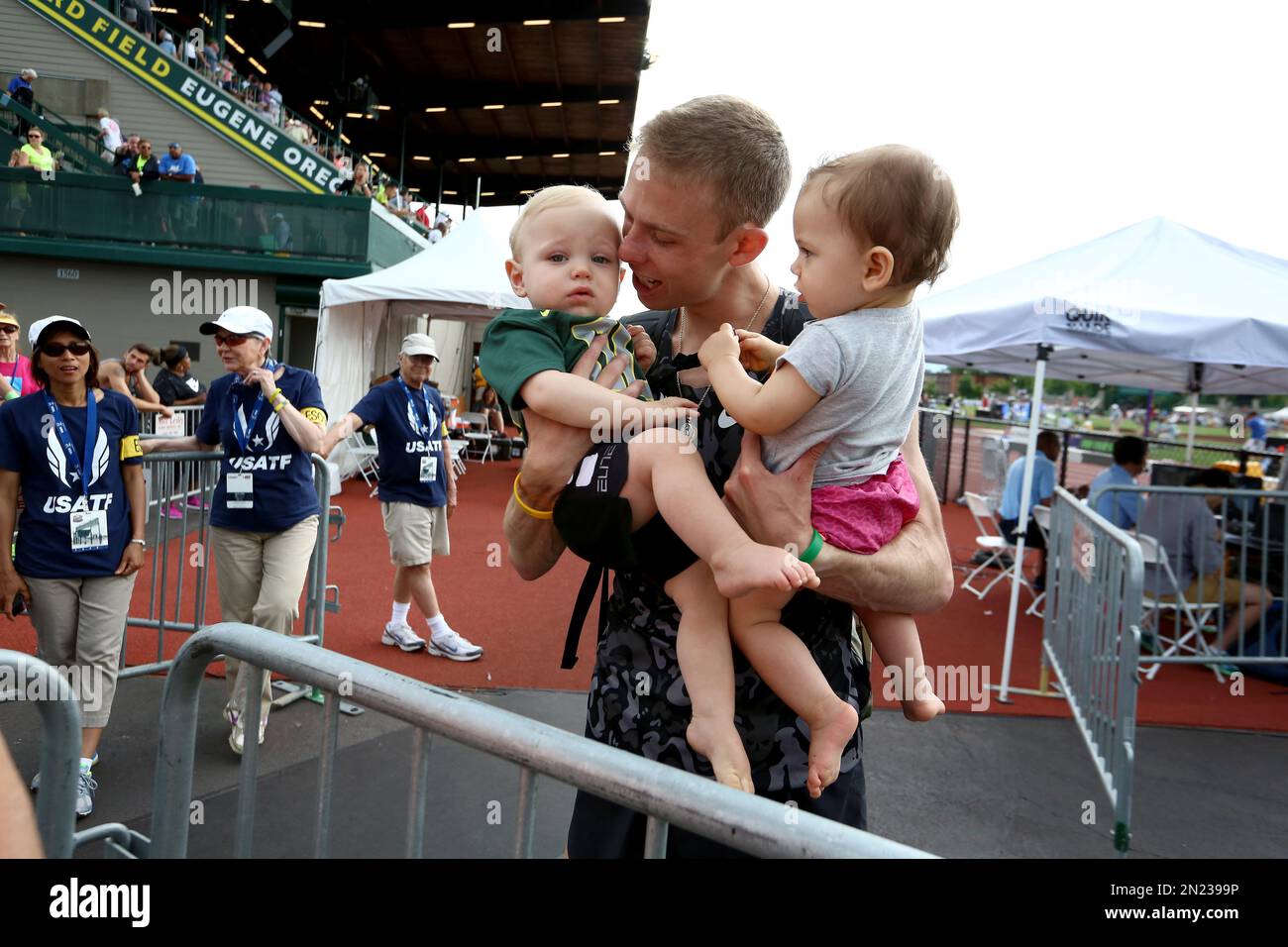 Galen Rupp is shown holding his children, Grayson, left, and Emmie ...