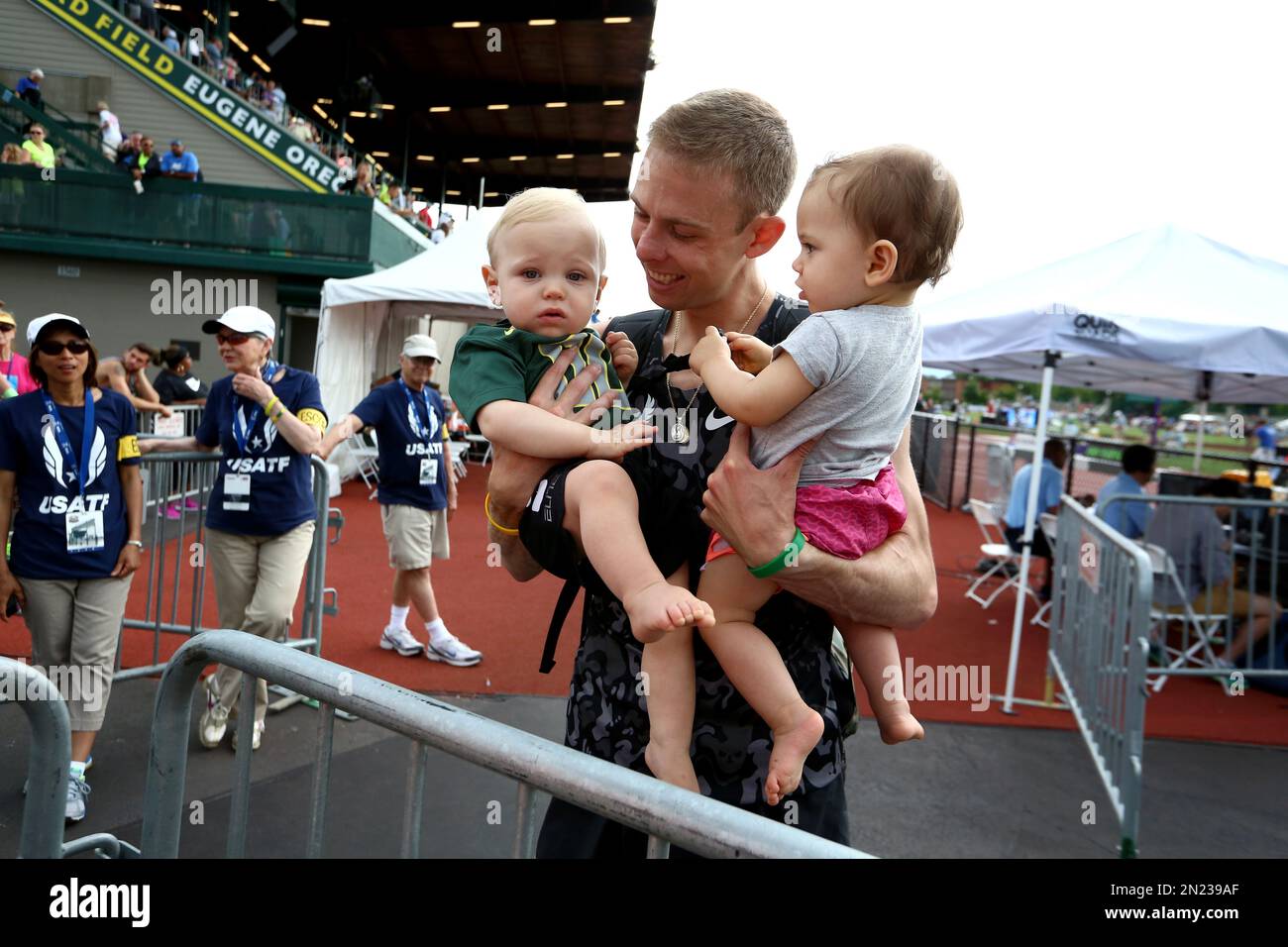 Galen Rupp is shown holding his children, Grayson, left, and Emmie ...