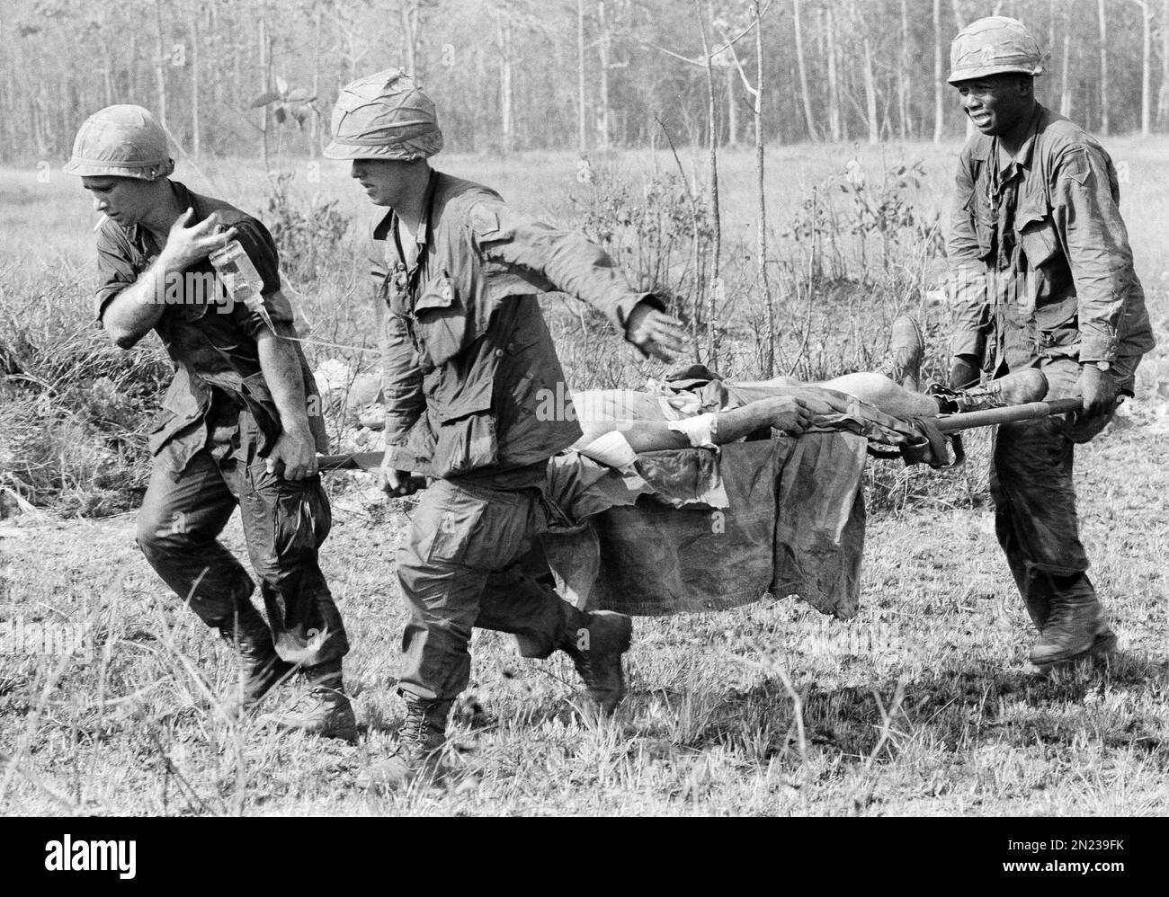 Soldier, wounded in War Zone C of South Vietnam, gets plasma as he is ...
