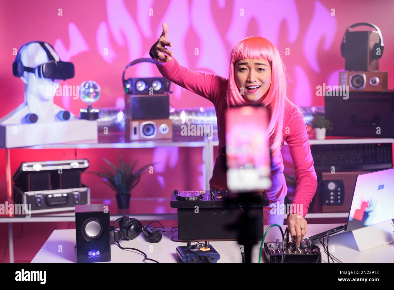 Artist having fun in studio while performing electronic song using ...