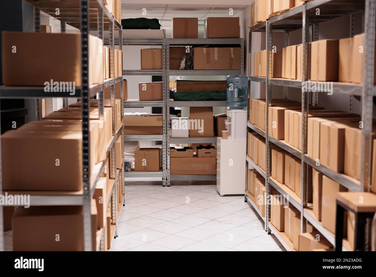 Cardboard boxes stacks on empty delivery service warehouse room shelves ...