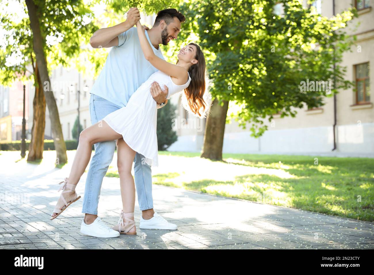Passionate couple dancing outdoors cute hi-res stock photography and ...