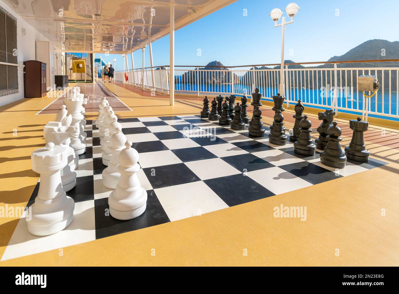 A large, giant size checker or chess board with black and white chess ...