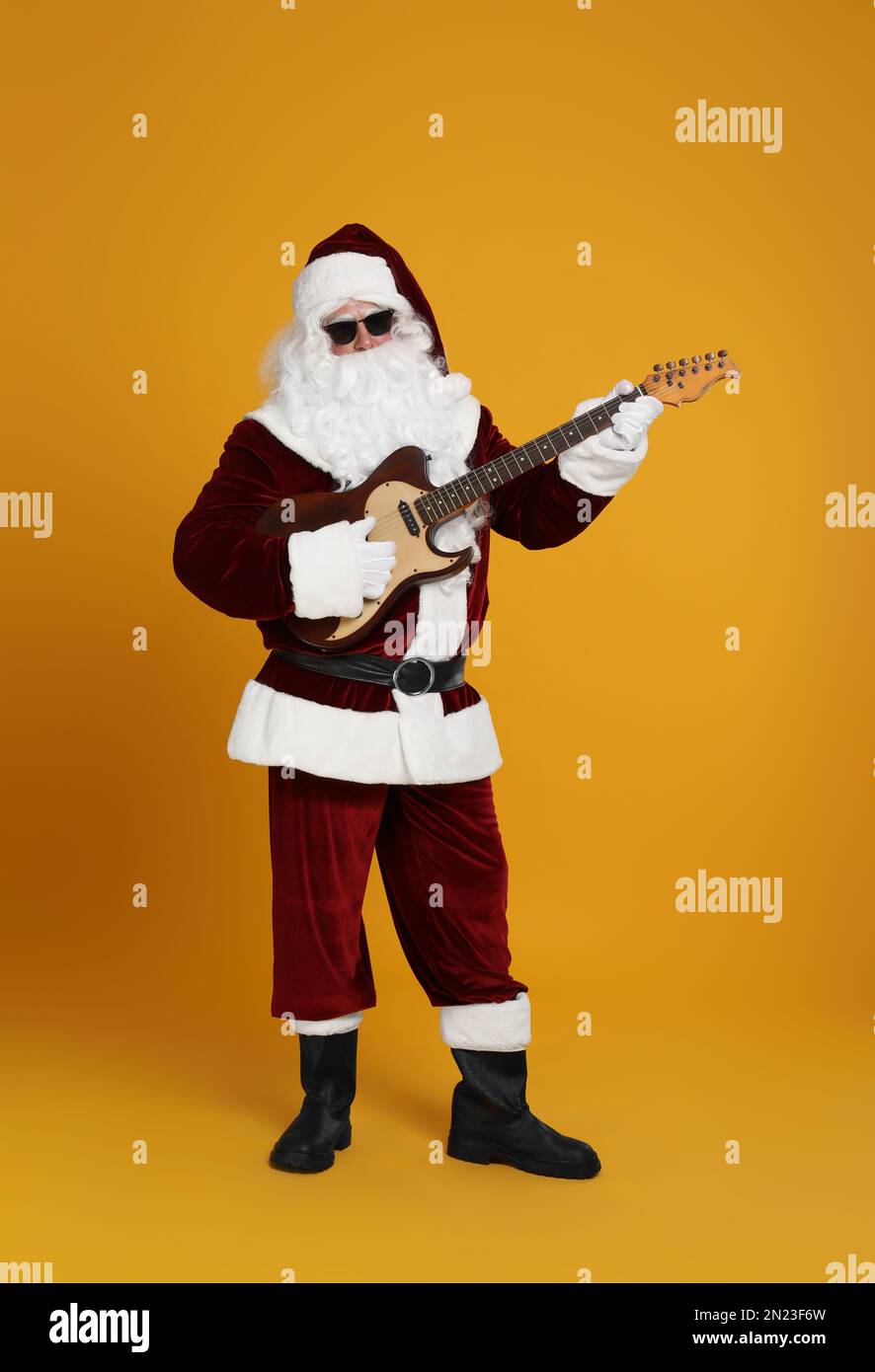 Santa claus playing electric guitar hi-res stock photography and images ...