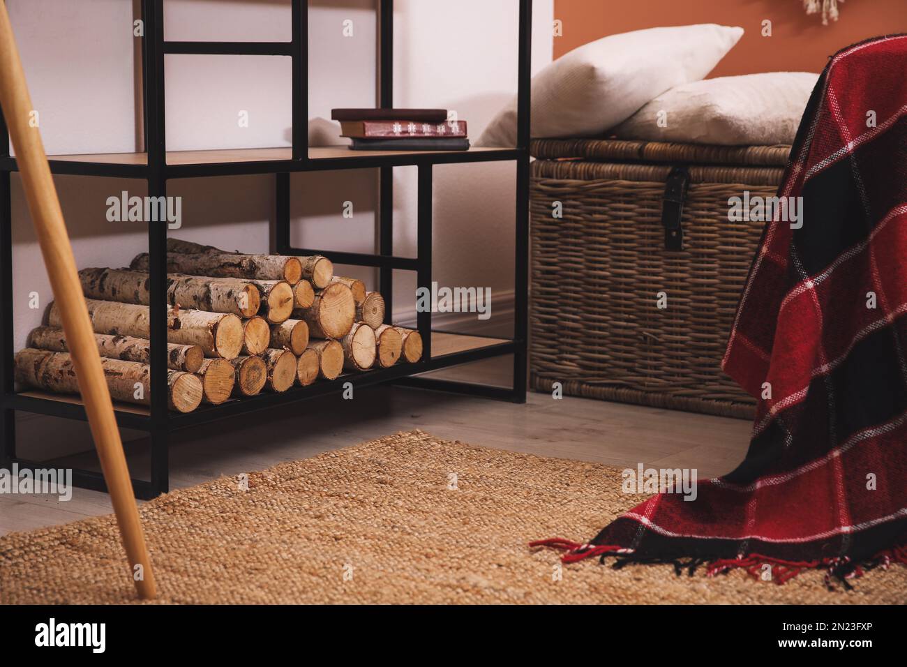 Shelving unit with firewood and books in room interior inspired by ...