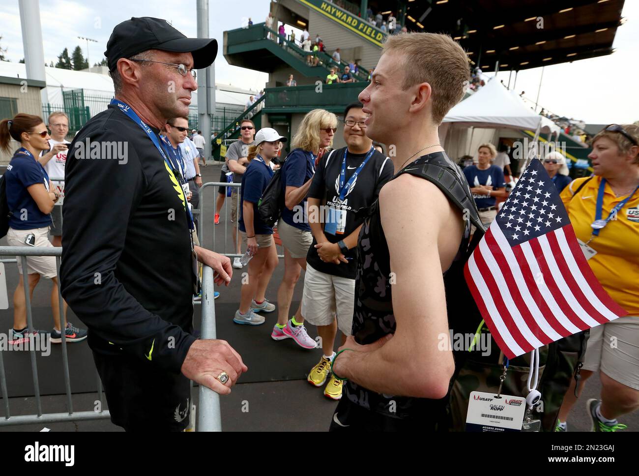 Galen Rupp, right, speaks to Alberto Salazar after finishing third in the 5000-meter at the U.S ...