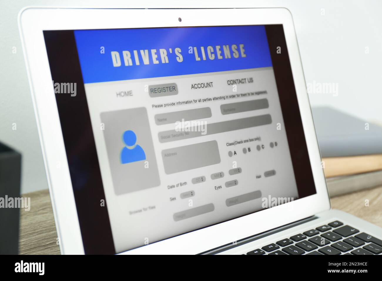 Laptop with driver's license application form on table, closeup Stock Photo - Alamy